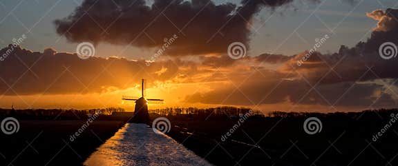 Backlit Dutch Windmill during Sunrise Stock Image - Image of ...