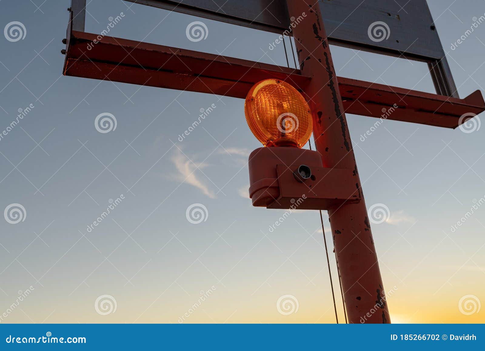 Backlit Highway Construction Warning Light at Sunset Stock Photo ...