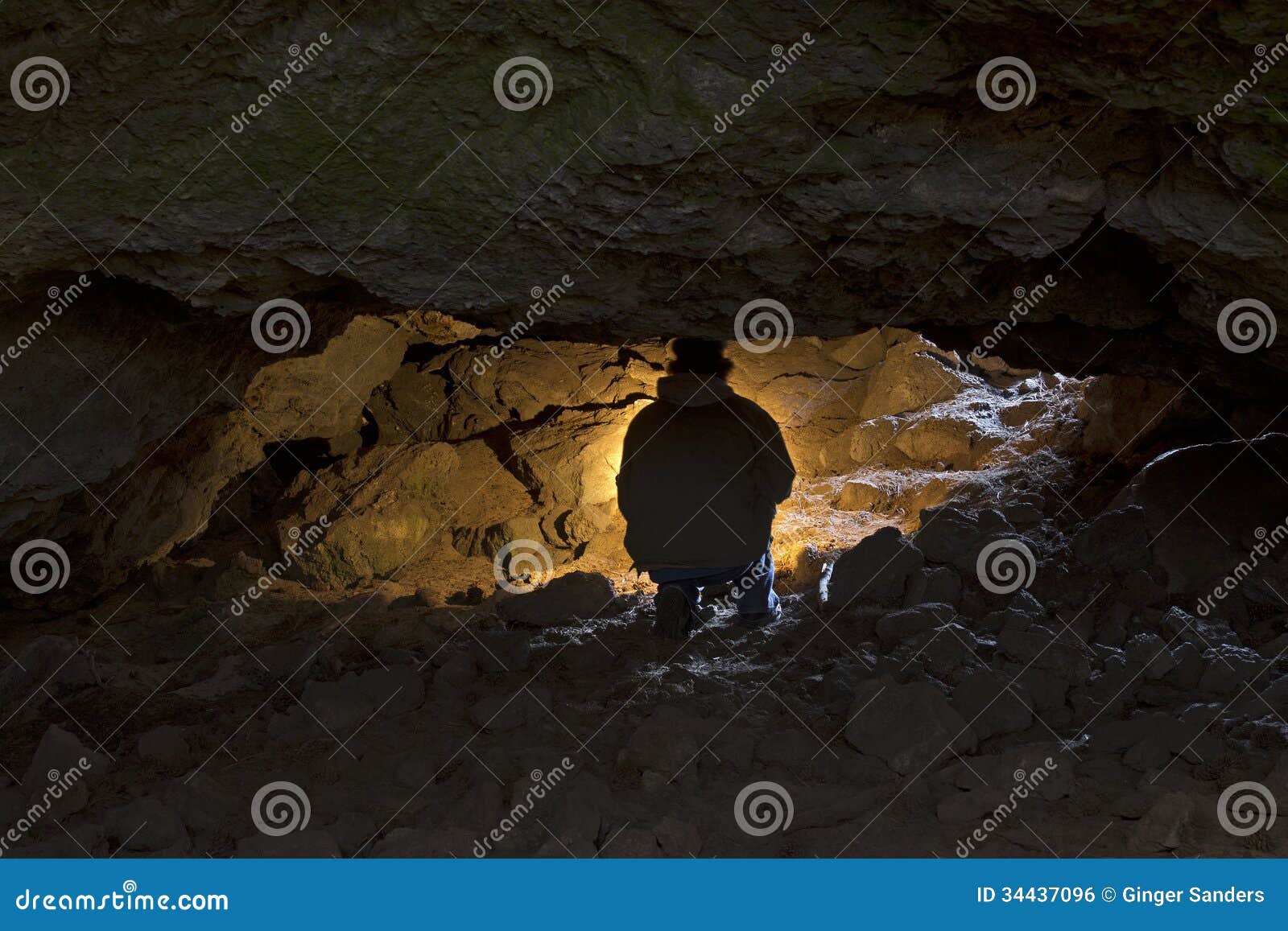 Backlit Man Exploring Dark Cave Stock Photo - Image of historic, tube ...