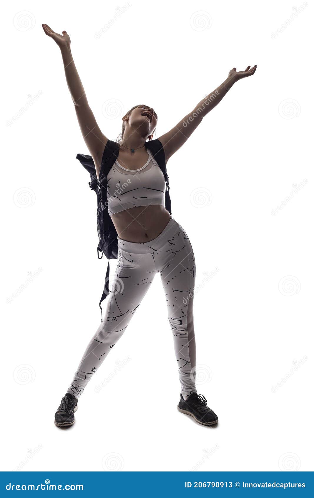 Backlit Model Posing As a Hiker or Backpacker on a White Background for ...