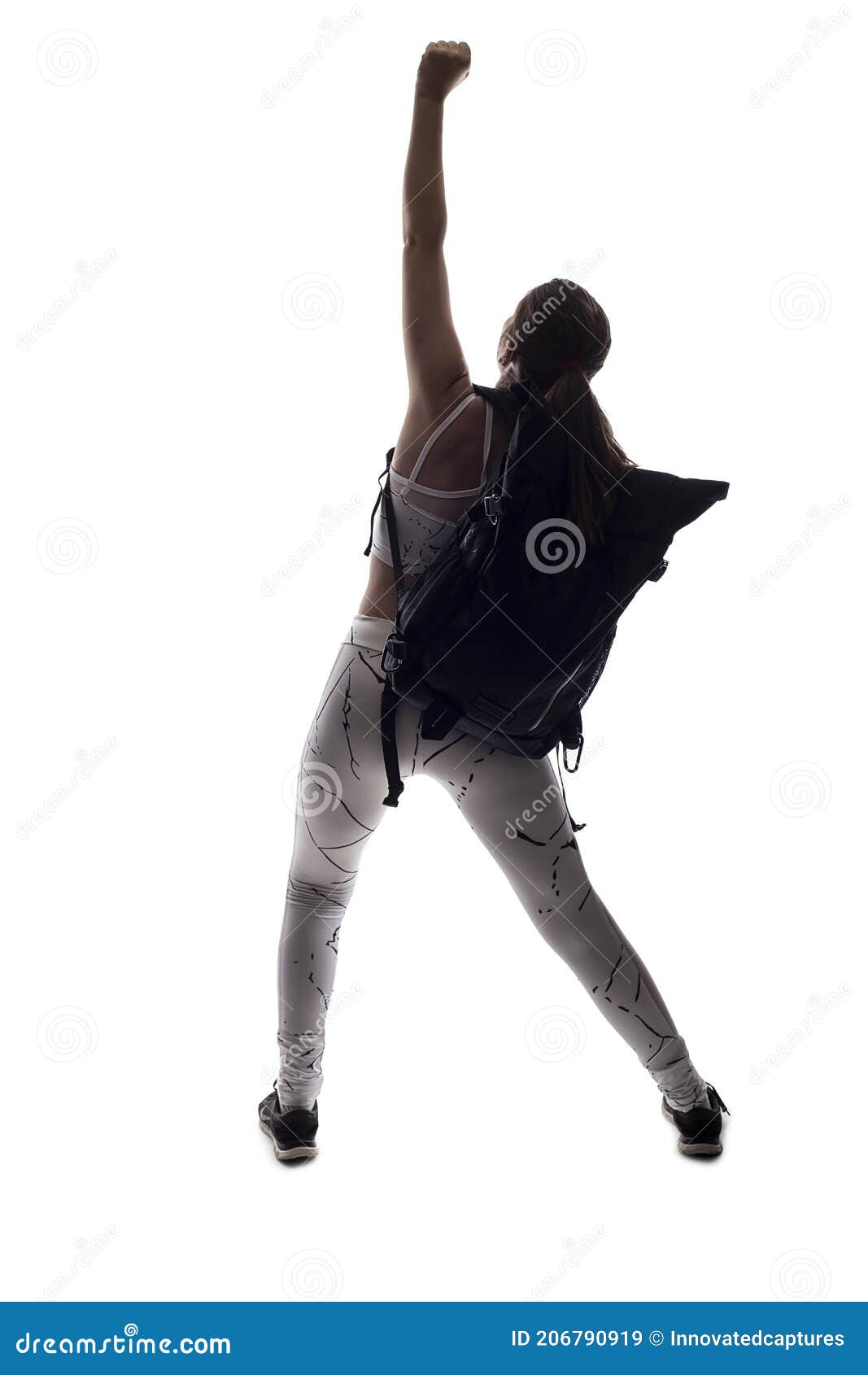 Backlit Model Posing As a Hiker or Backpacker on a White Background for ...