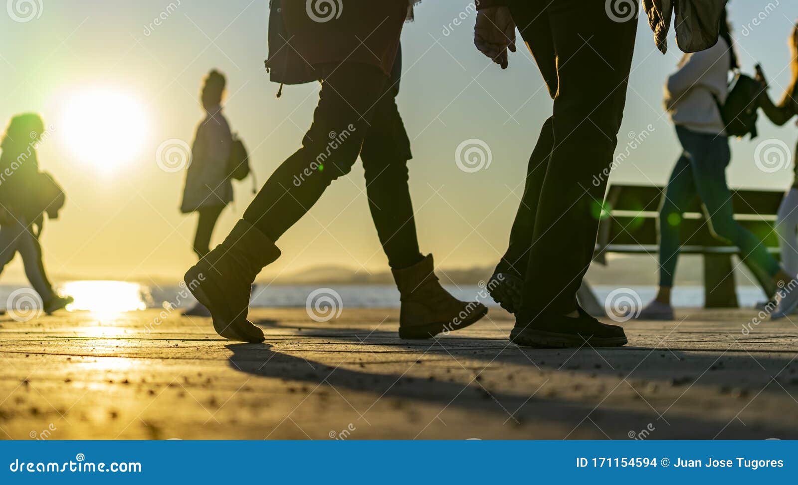 Backlit people walking stock photo. Image of summer - 171154594