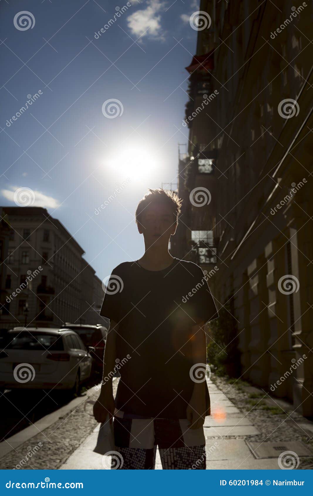 Backlit Shot of a Boy on a Street Stock Photo - Image of male, model ...