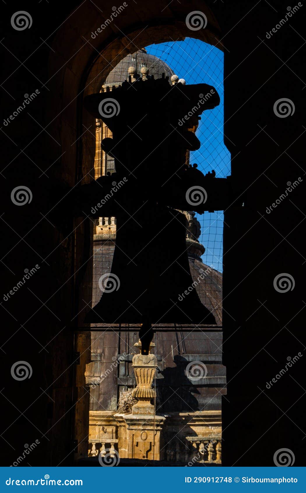 Backlit Silhouette of Bronze Bell of the Old Cathedral with the View of ...