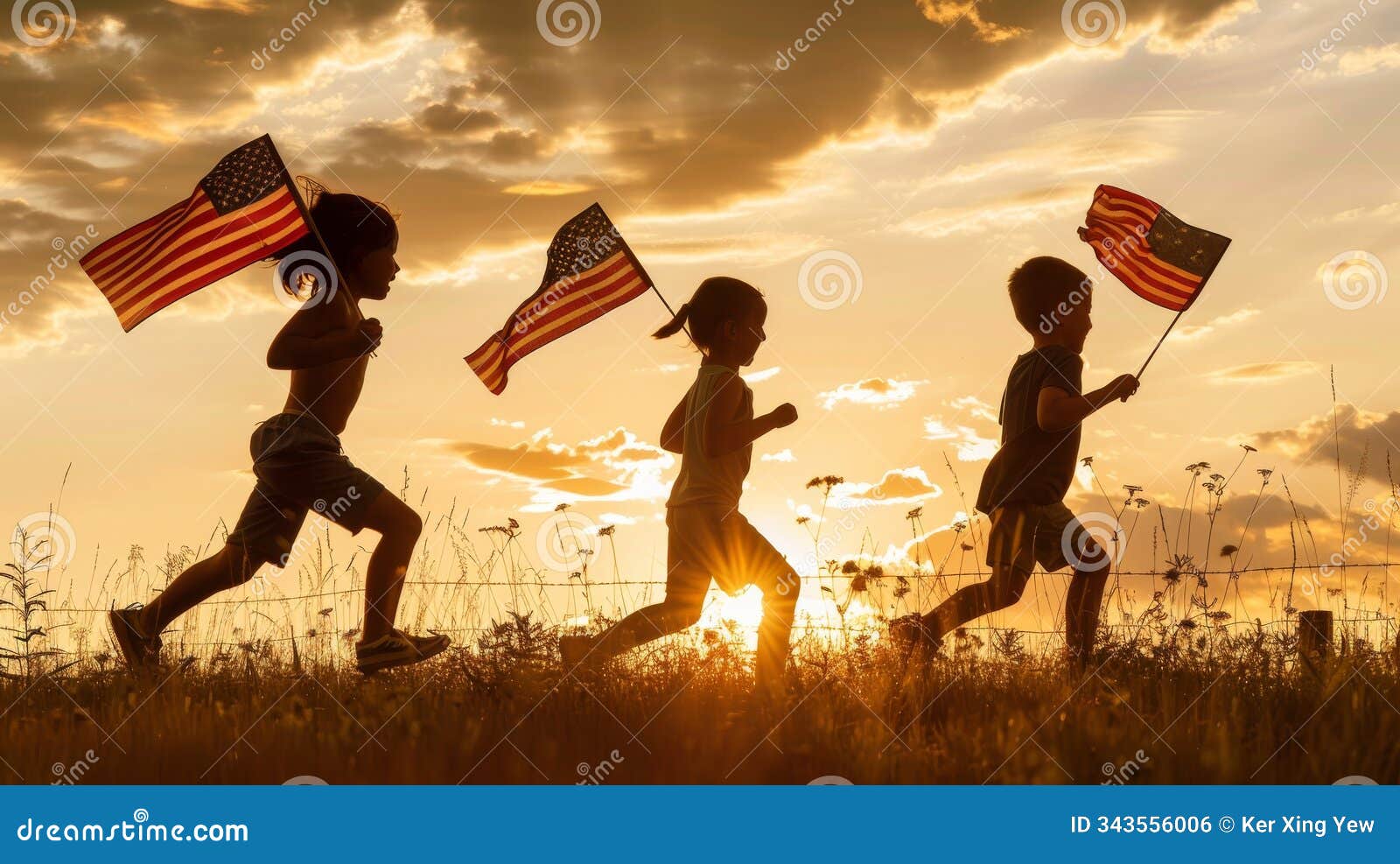 Backlit Silhouette of Children Running with American Flags on July 4th ...