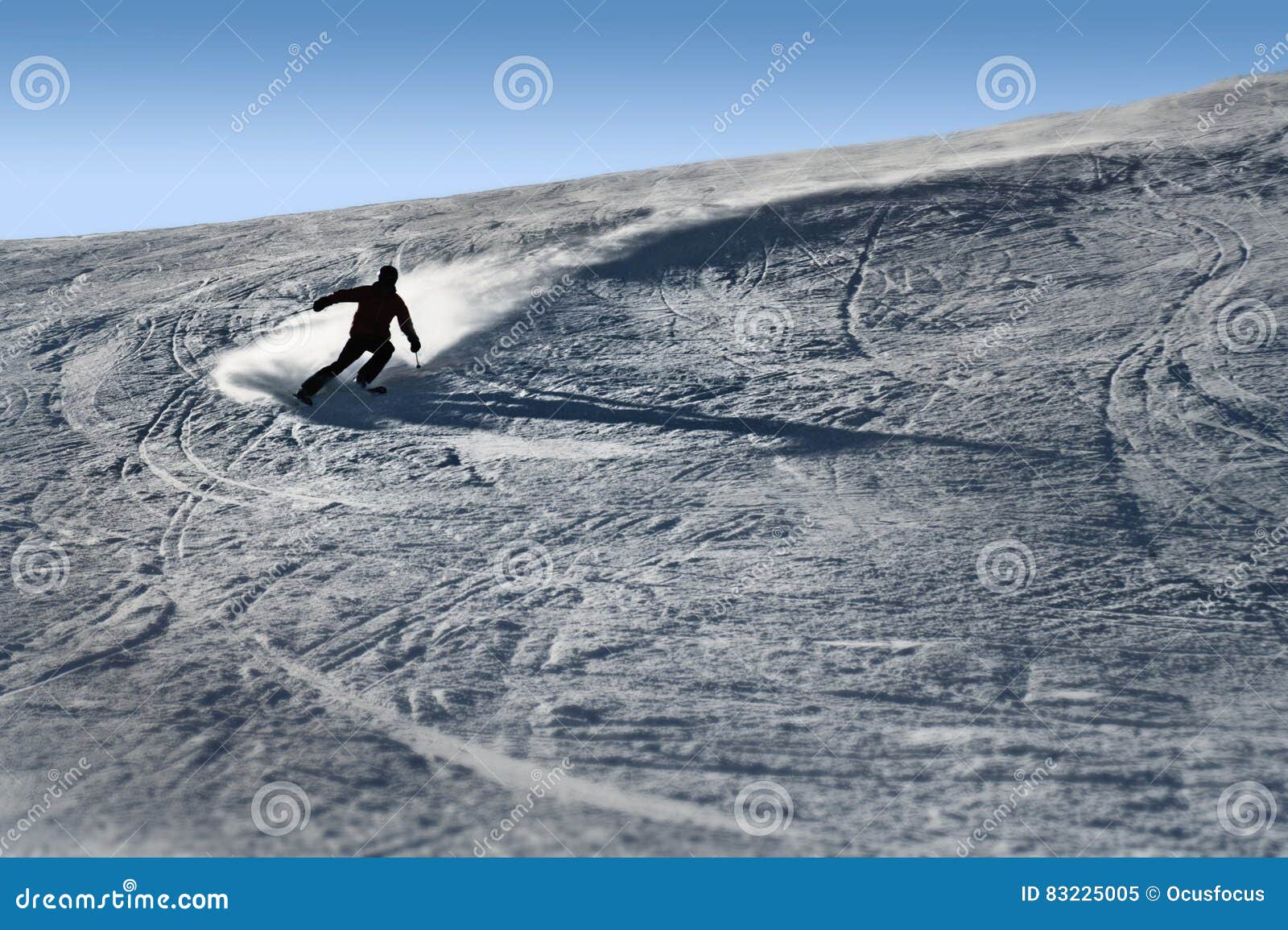 Backlit Silhouette of Man in Action Practicing Ski Going Fast and ...