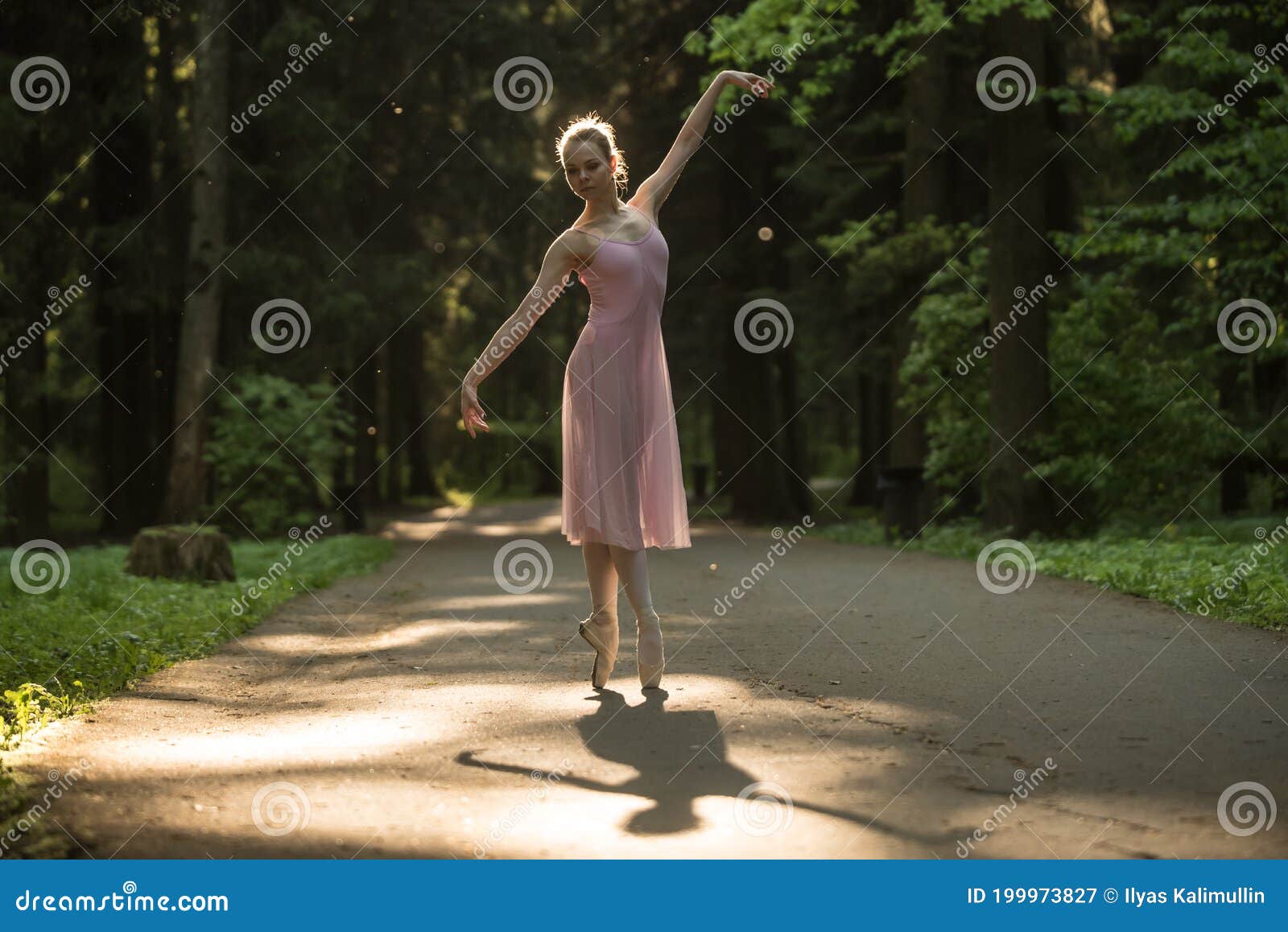Backlit Silhouette of Young Ballerina Dancing in the Park with Dancing ...