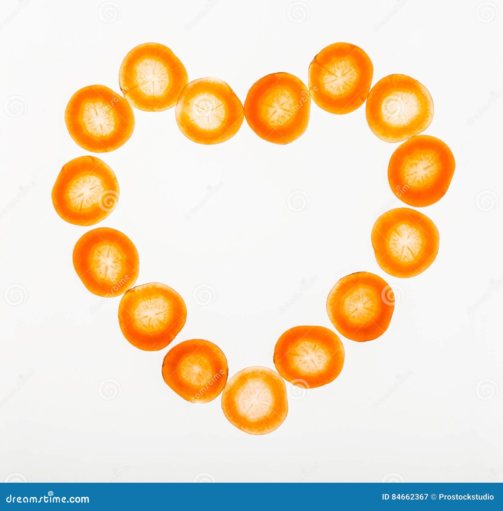Backlit Slices of Carrot in Heart Shape, Abstract Textured Background ...