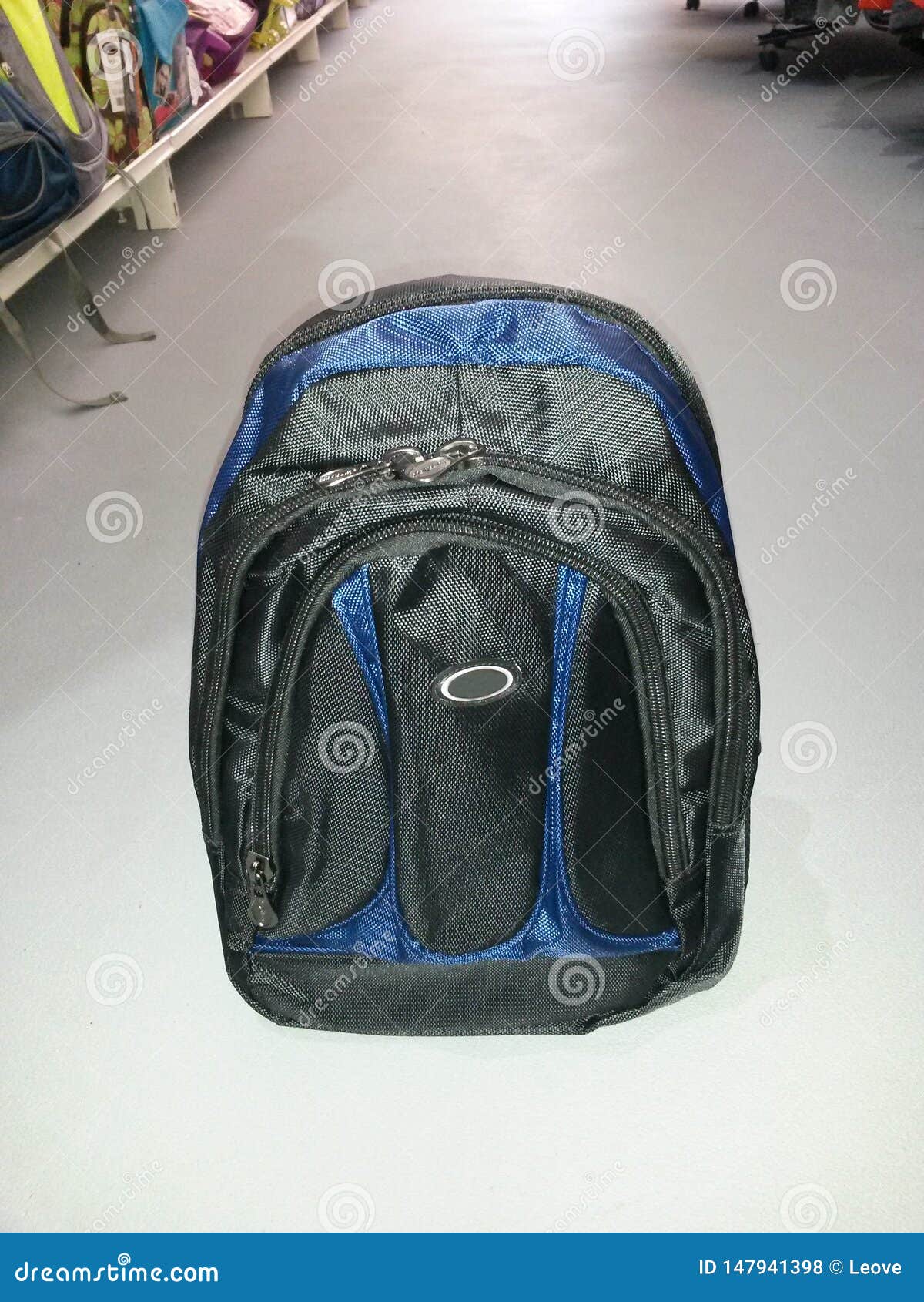 Backpack Black-blue on the Ground in Backpacks and Clothes Store Stock ...