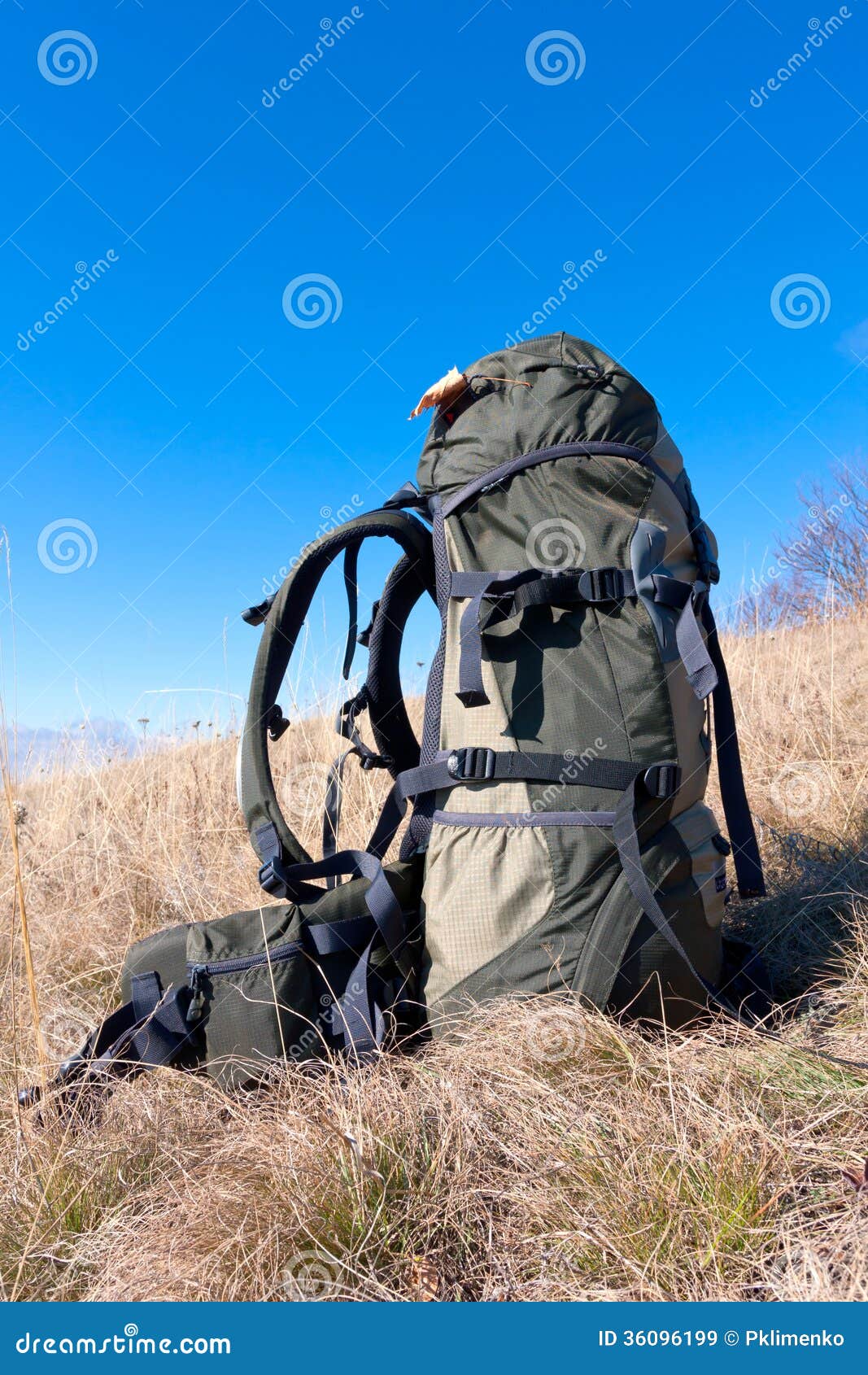 Backpack on Field in Mountains Stock Image - Image of field, mountains ...