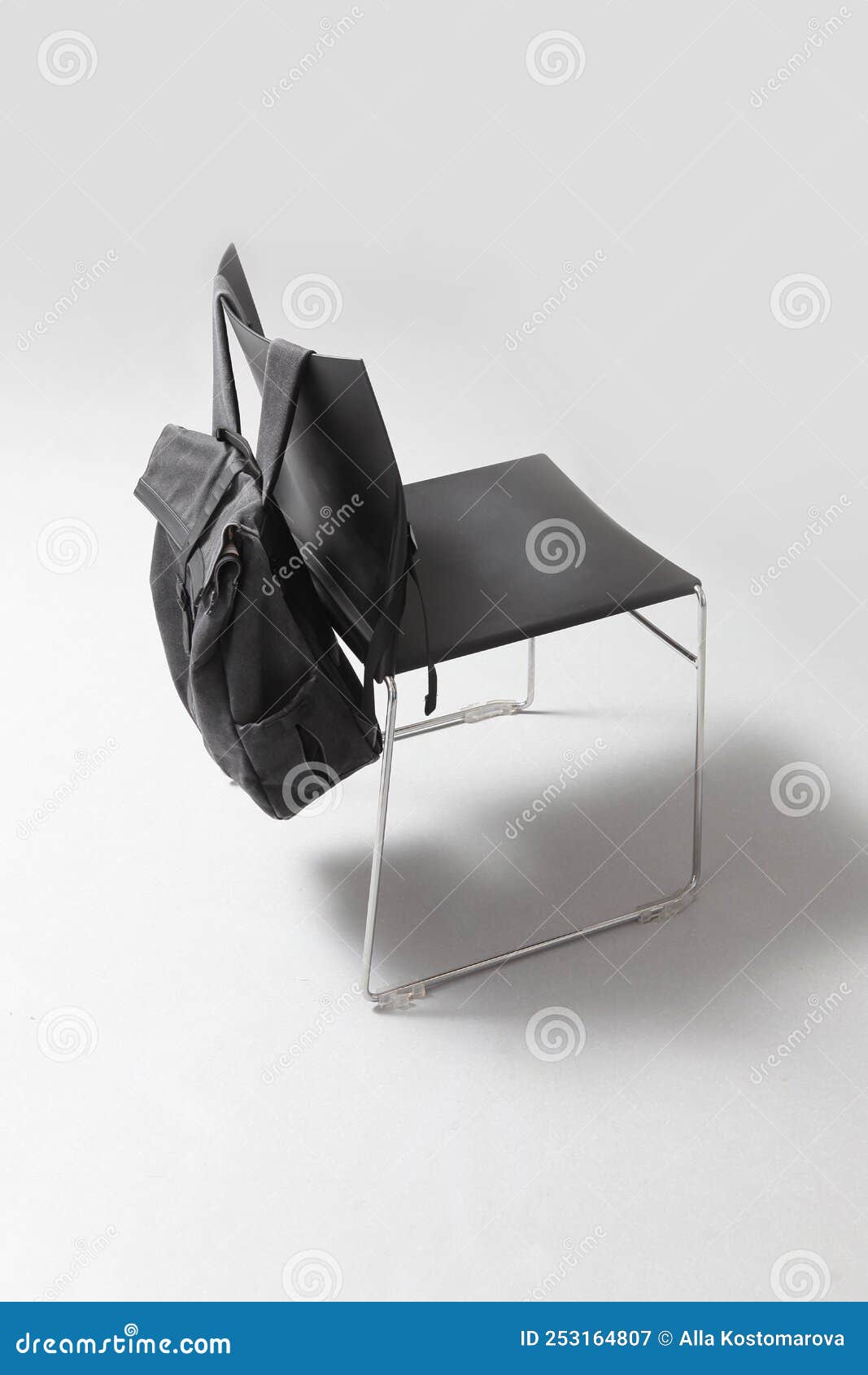 The Backpack is Hanging on the Back of a Chair. an Abandoned ...
