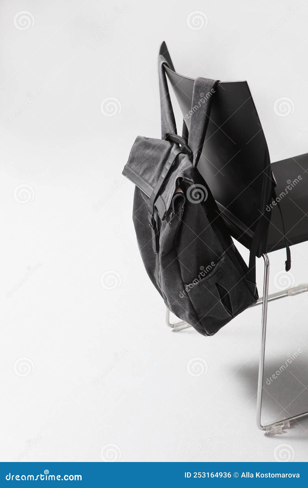The Backpack is Hanging on the Back of a Chair.an Abandoned, Unattended ...