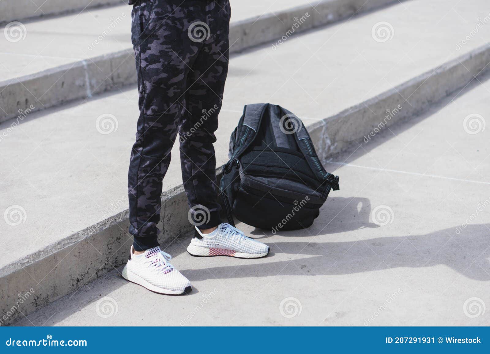 Backpack Laying at a Males Feet Outdoors Stock Image - Image of travel ...