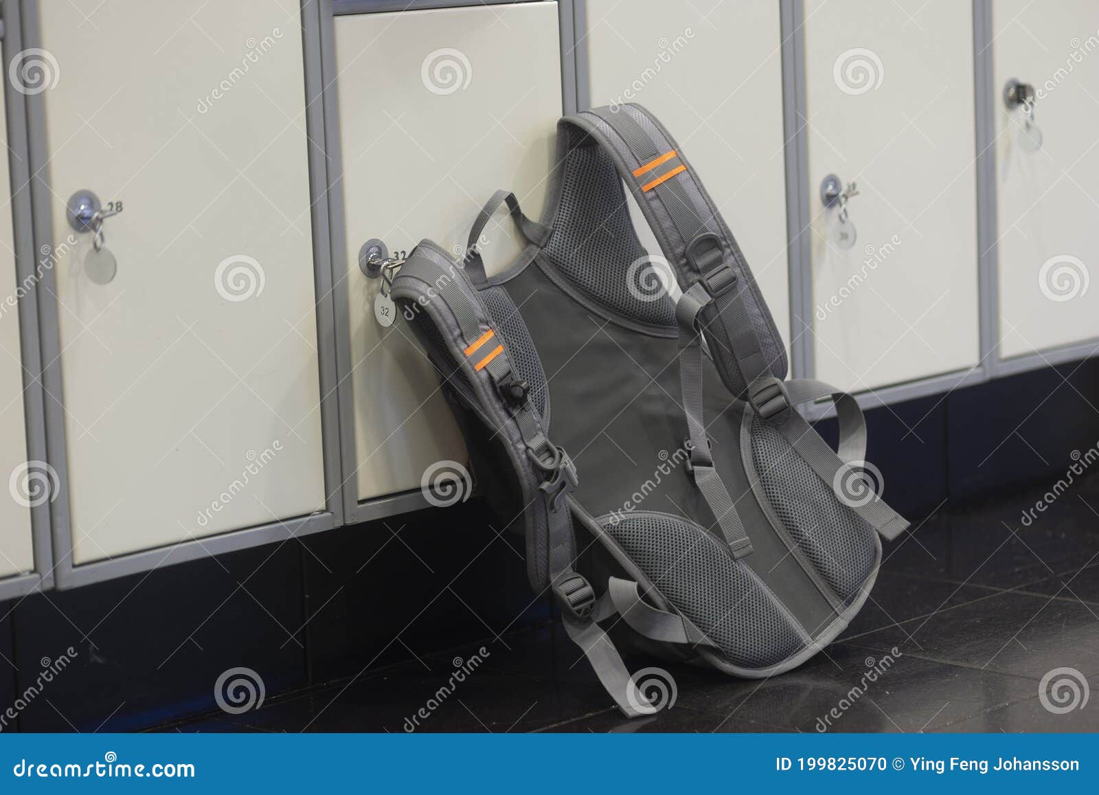 Backpack in locker rooom stock photo. Image of locker - 199825070