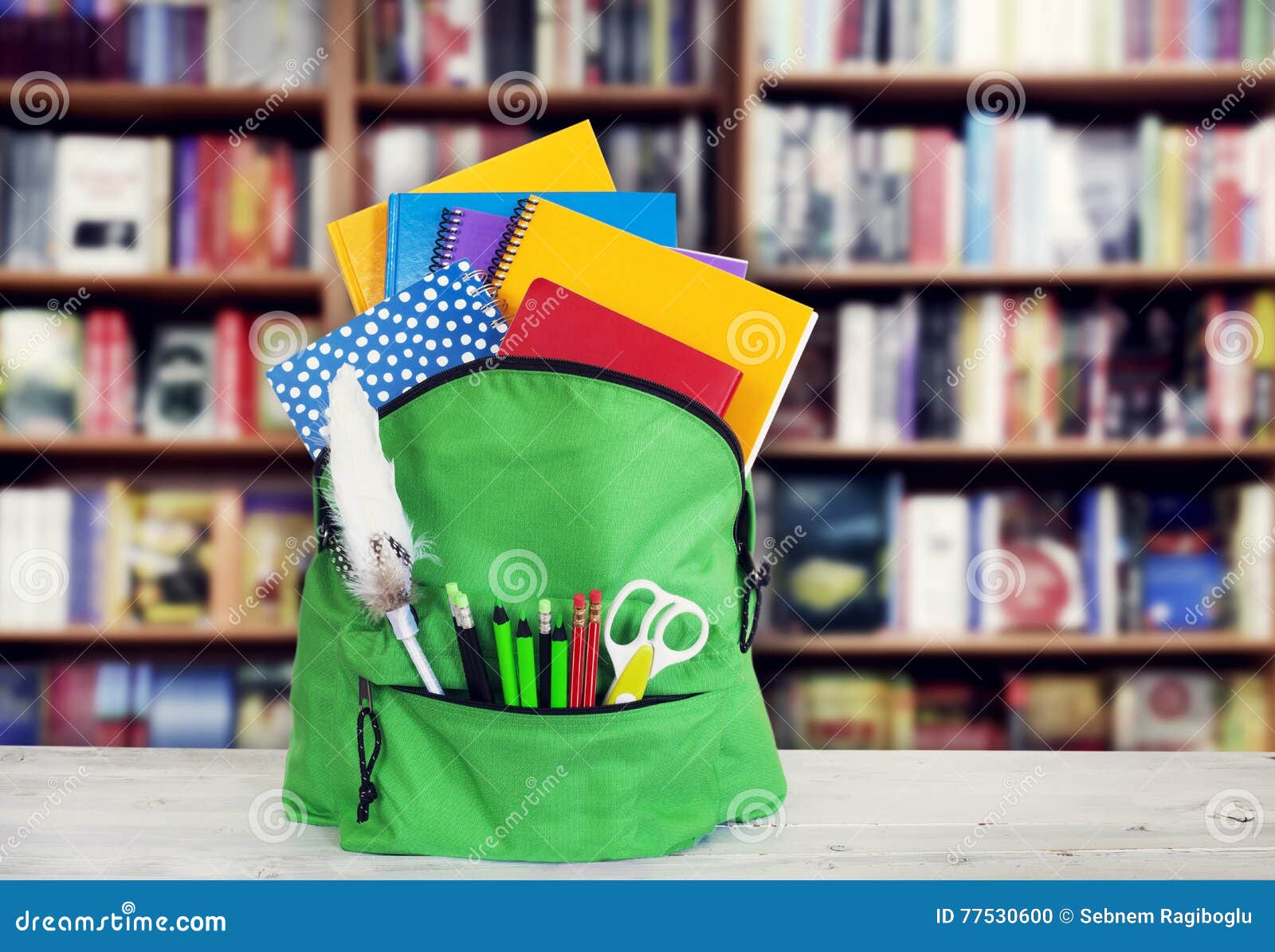 Backpack on Wooden Table in Library Stock Photo - Image of book, full ...
