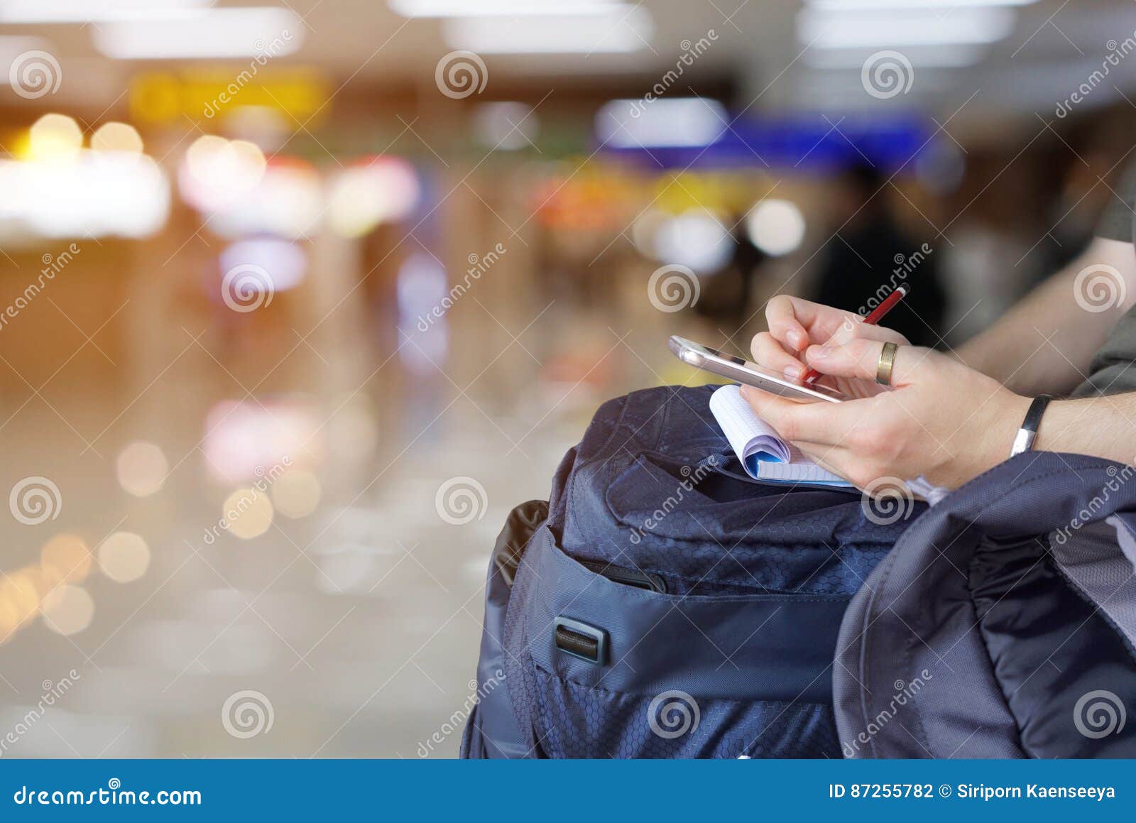 Backpacker Checking the Map on Smart Phone Plan for the Trip Stock ...