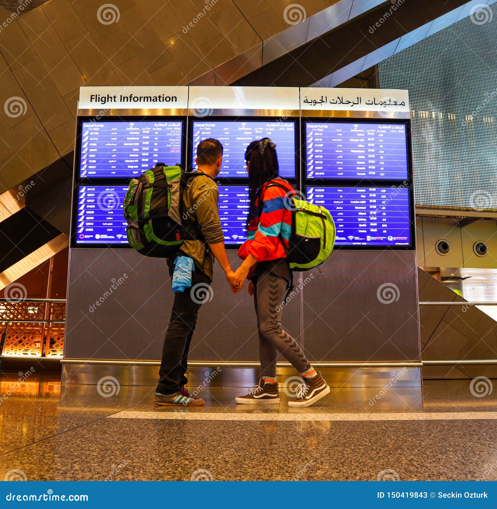Backpacker Couple at the Airport in Doha Editorial Stock Photo - Image ...