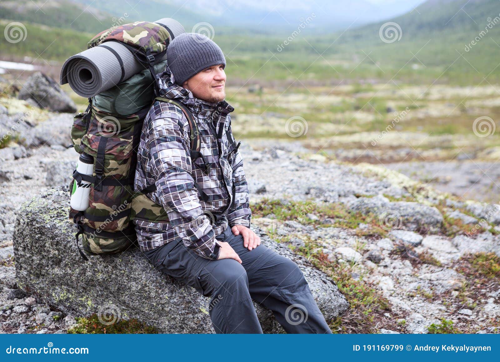 Backpacker Enjoying while Resting on Stone in Mountain Valley, Tired ...