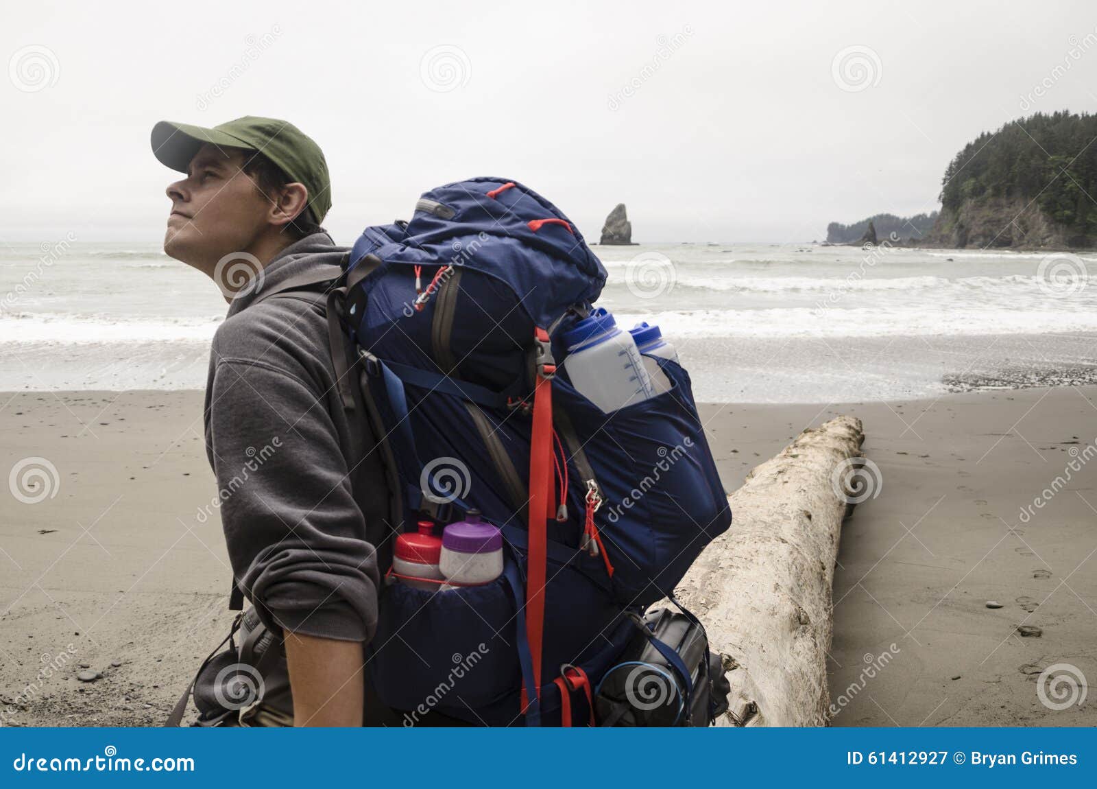 Backpacker Gazing Up at the Beach Stock Image - Image of drift, tide ...