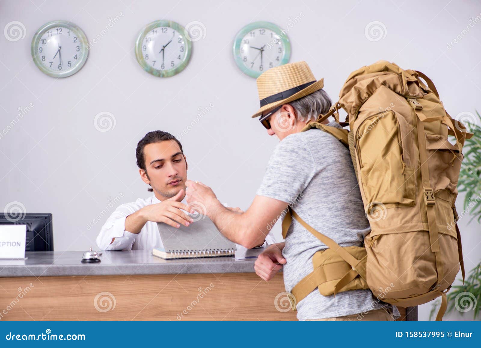 Backpacker at the Hotel Reception Stock Image - Image of backpacker ...