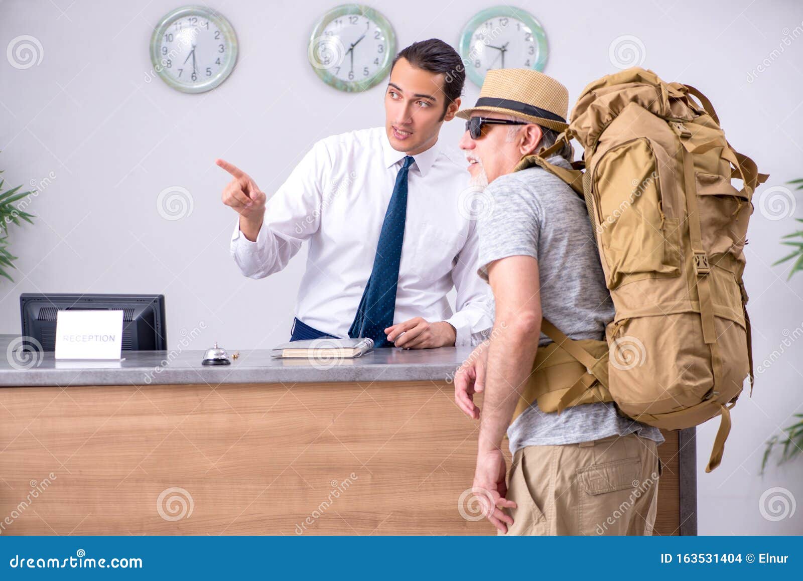Backpacker at the Hotel Reception Stock Photo - Image of hotel ...