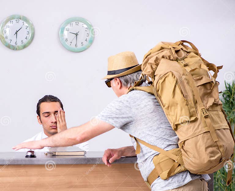Backpacker at the Hotel Reception Stock Image - Image of office ...