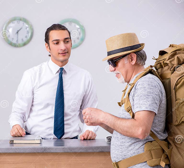 Backpacker at the Hotel Reception Stock Image - Image of departing ...
