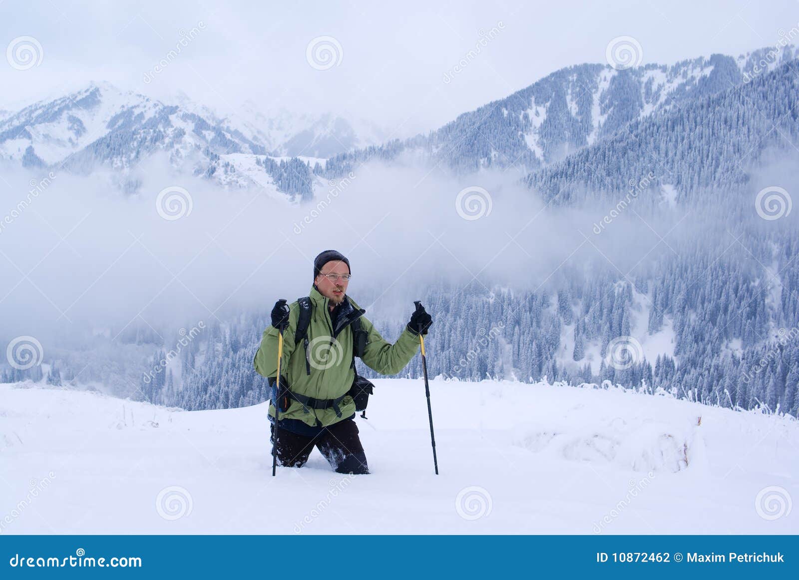 A Backpacker Man Going in Winter Mountains Stock Photo - Image of ...