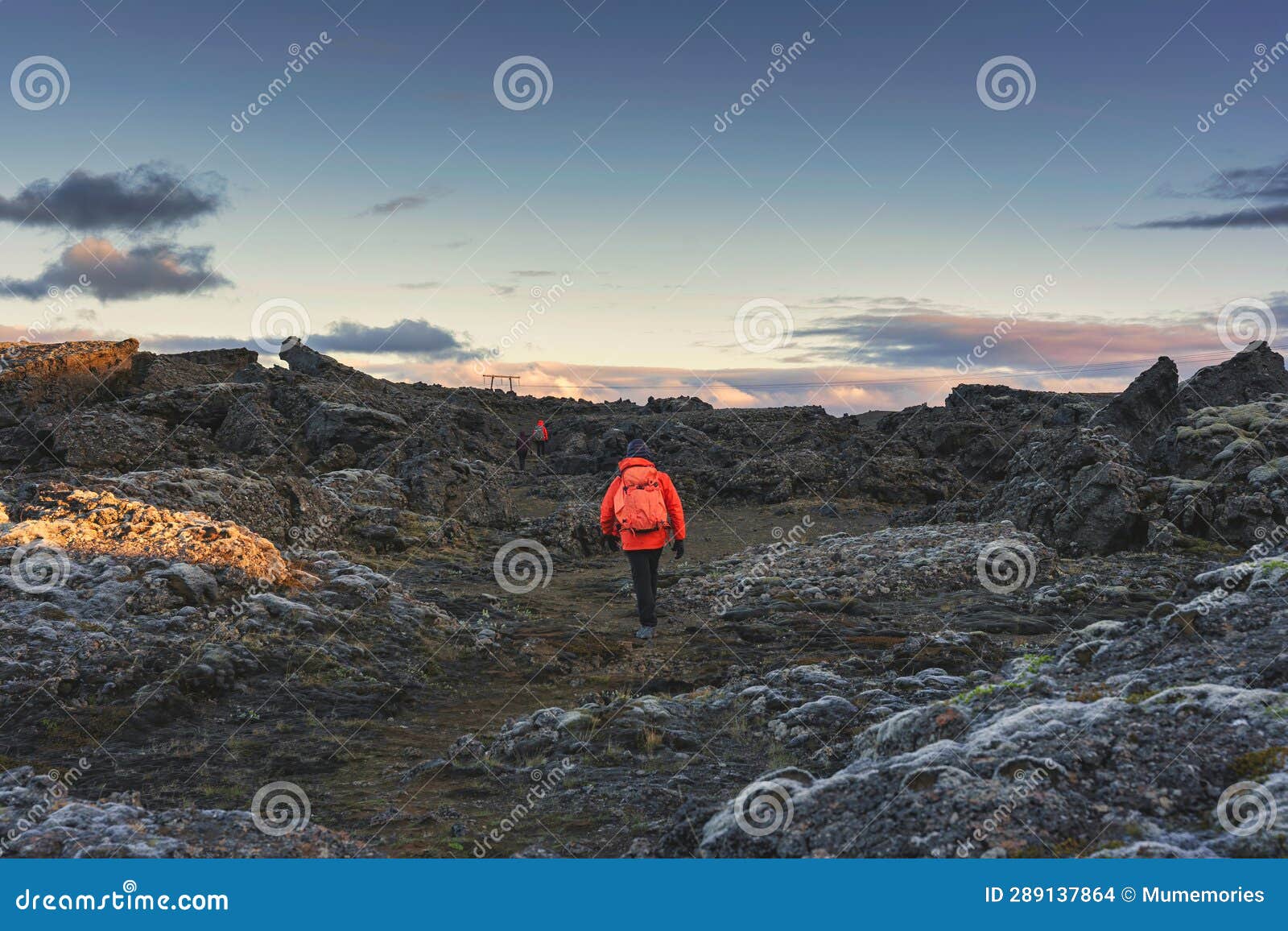 Backpacker Walking on Lava Field in Remote Wilderness Stock Photo ...