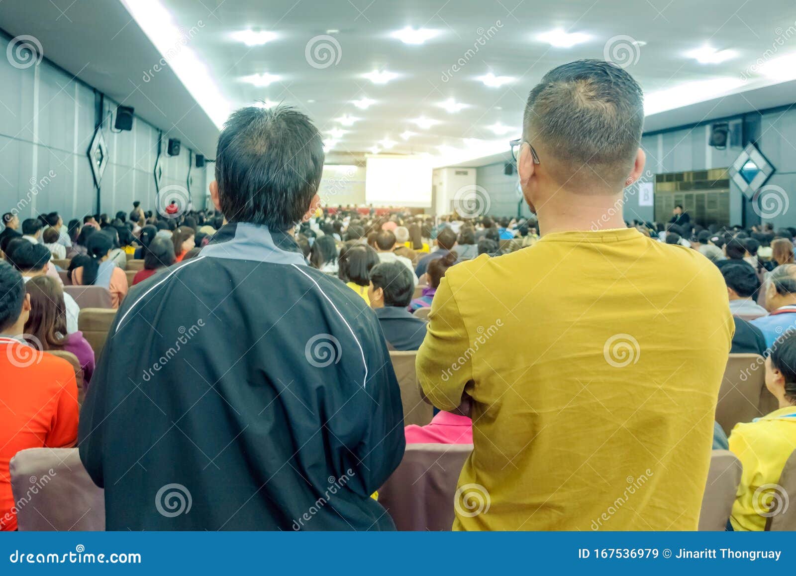 Backside View of Spectators Standing in a Gathering in the Back of ...