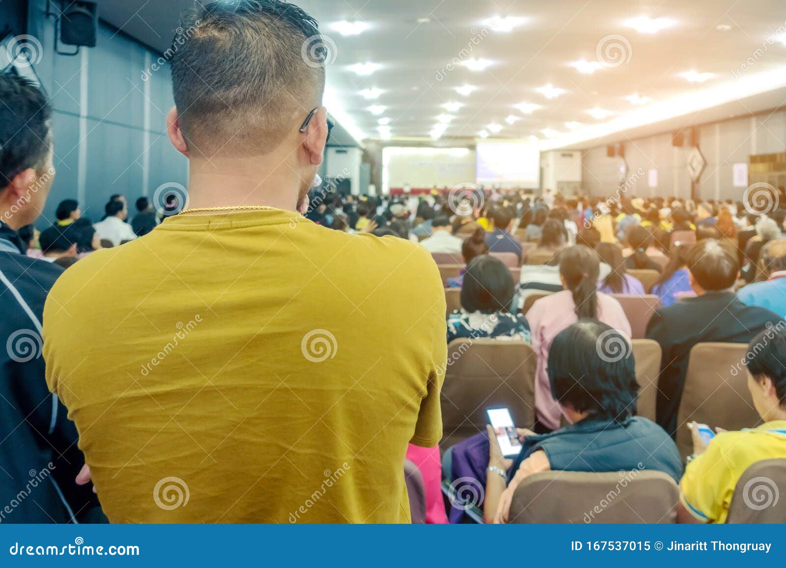 Backside View of Spectators Standing in a Gathering in the Back of ...