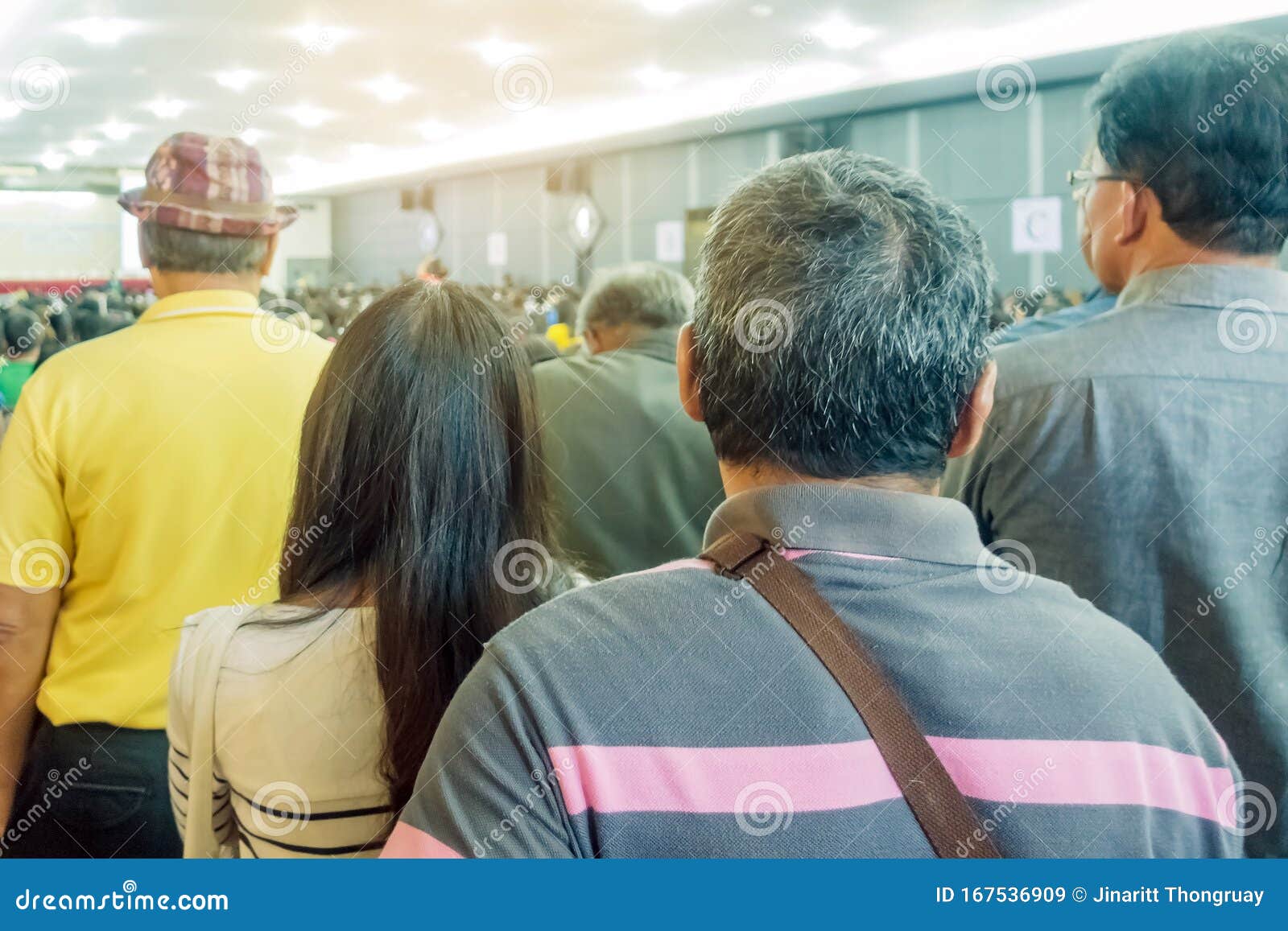 Backside View of Spectators Standing in a Gathering in the Back of ...