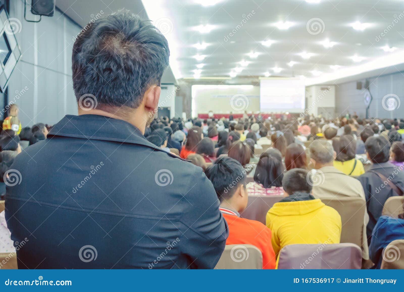 Backside View of Spectators Standing in a Gathering in the Back of ...