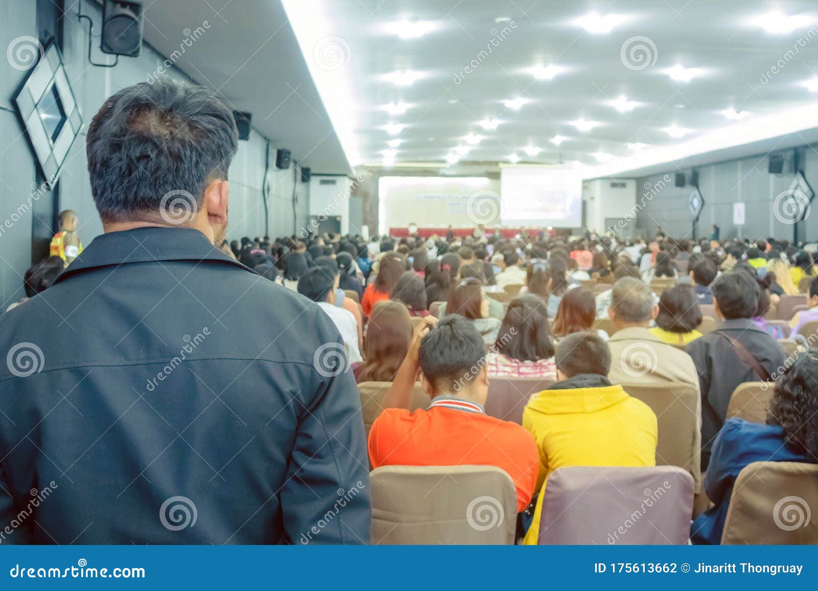 Backside View of Spectators Standing in a Gathering in the Back of ...