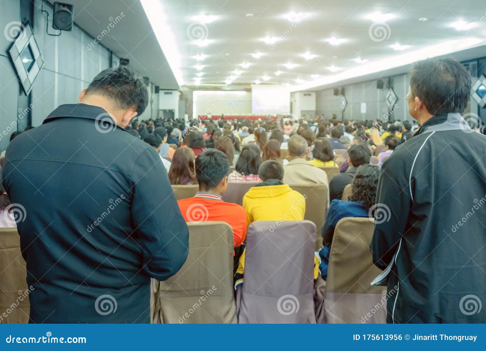 Backside View of Spectators Standing in a Gathering in the Back of ...