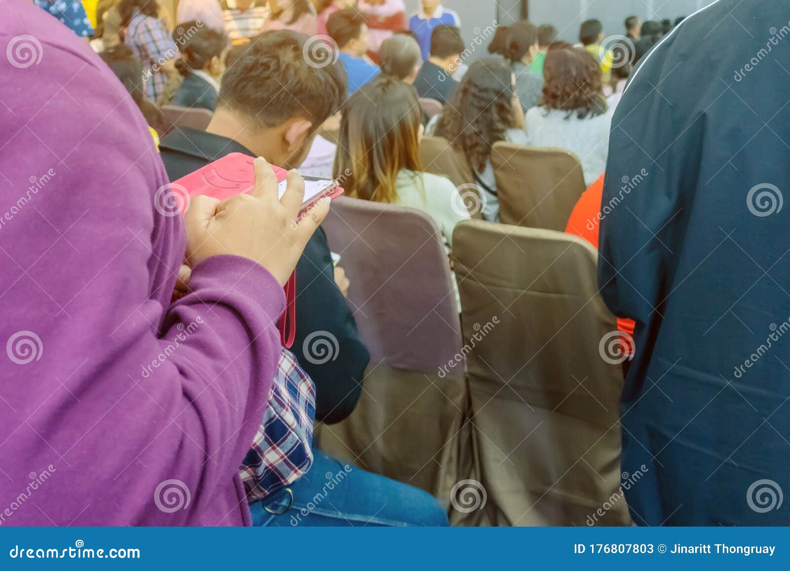 Backside View of Spectators Standing in a Gathering in the Back of ...