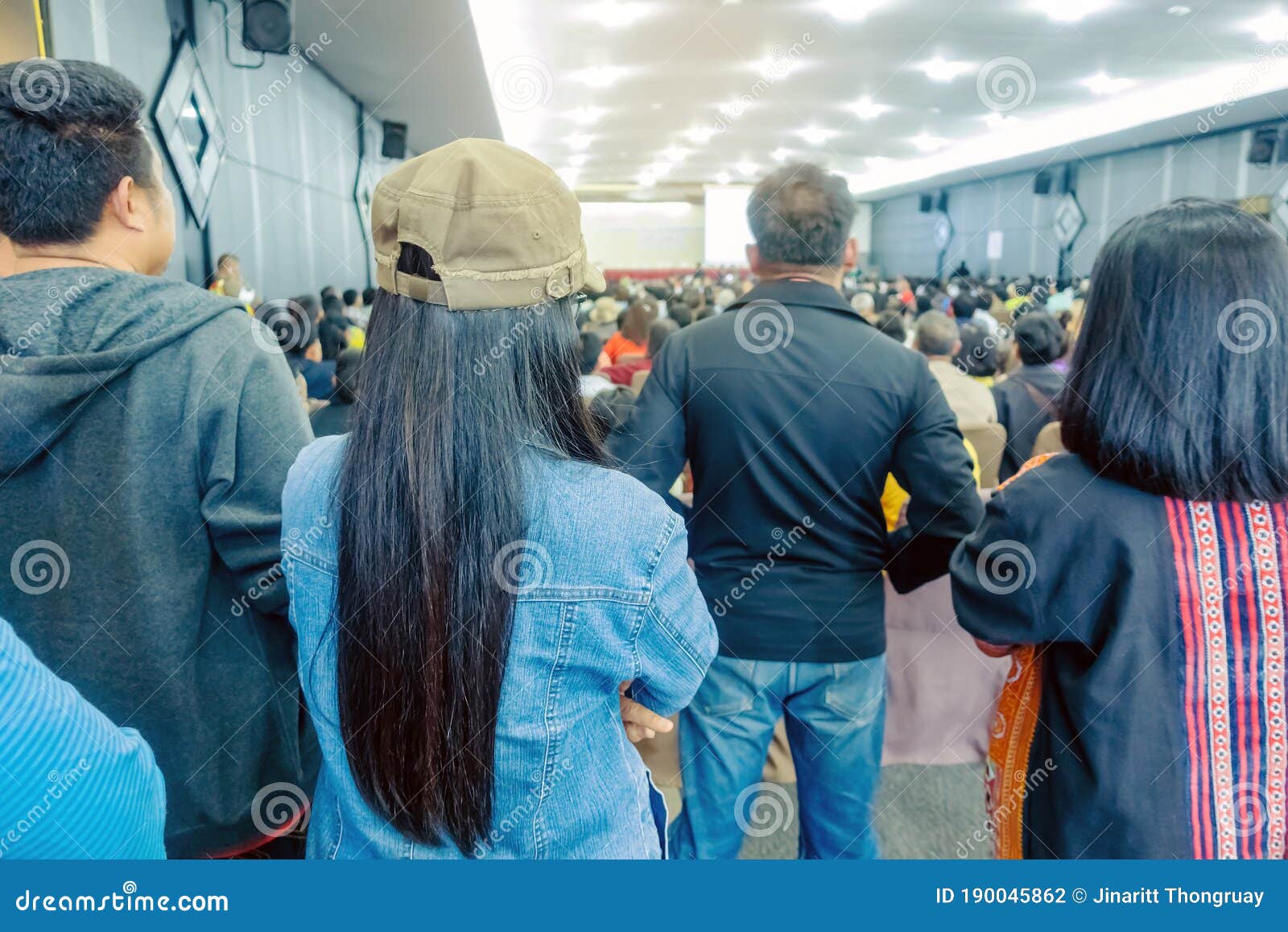 Backside View of Spectators Standing in a Gathering in the Back of ...