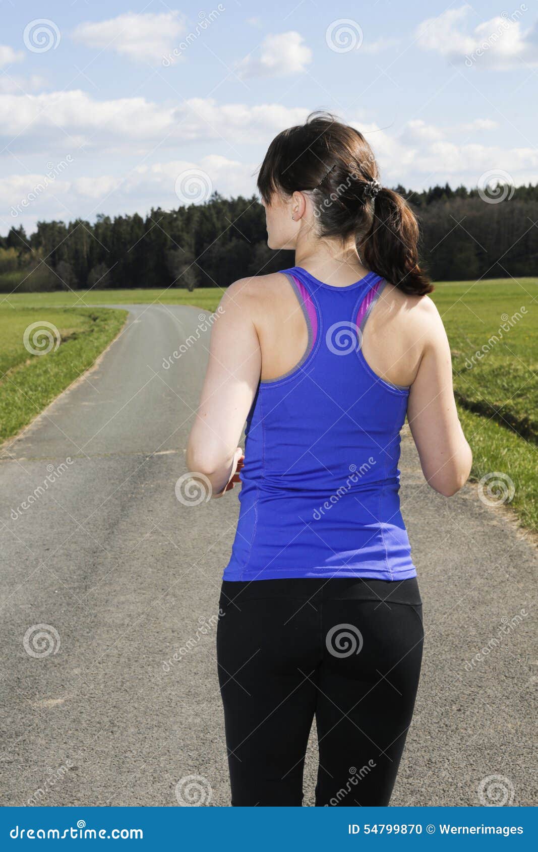 Backside of a Young Woman Jogging Outdoors Stock Photo - Image of ...