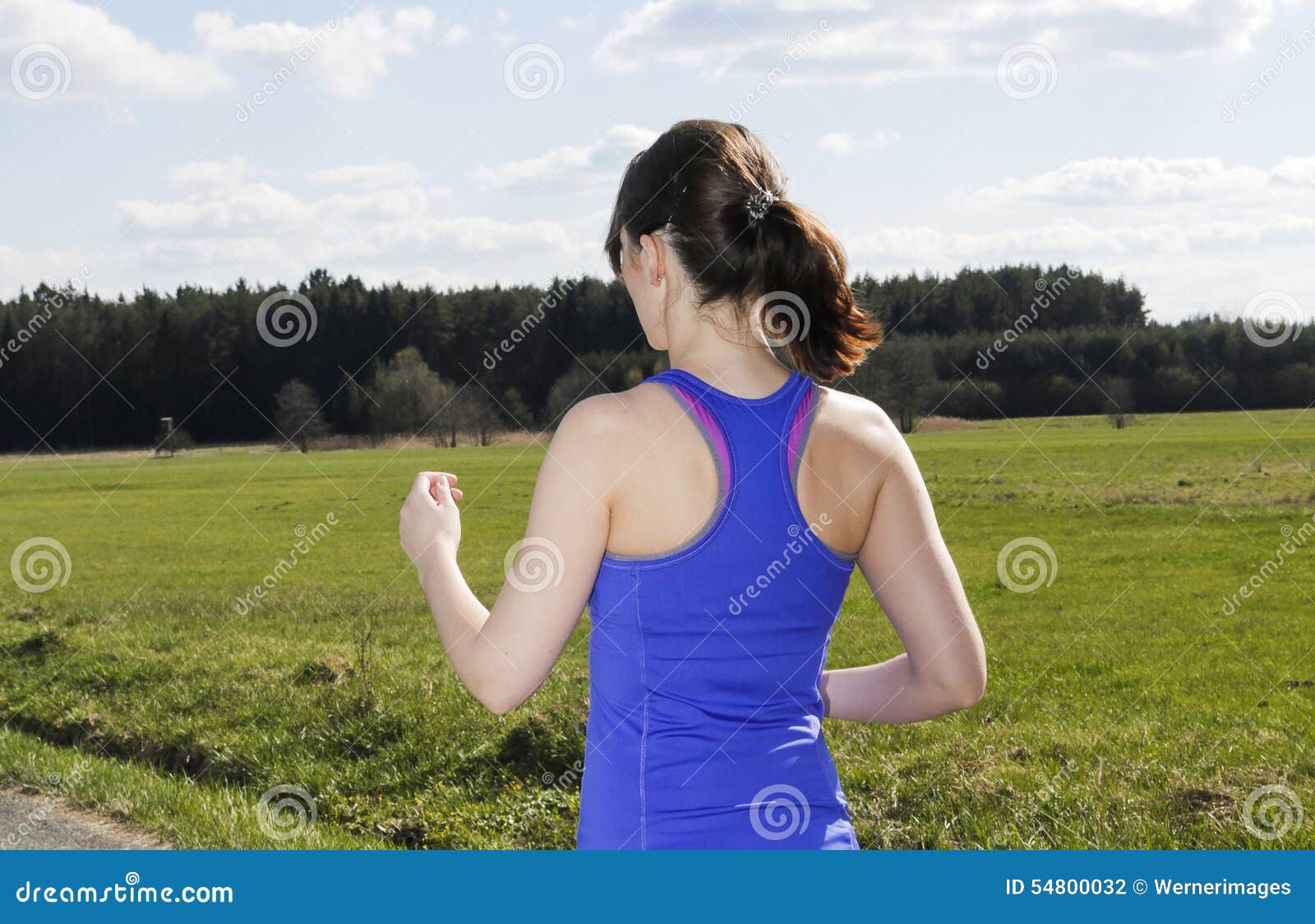 Backside of a Young Woman Jogging Outdoors Stock Photo - Image of ...