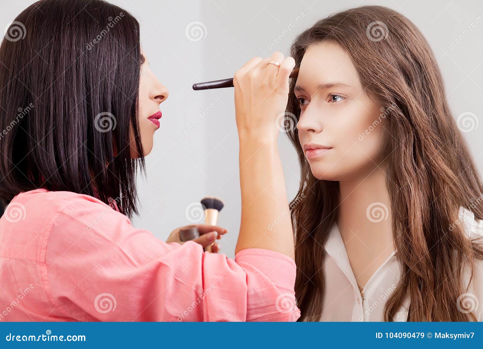 Backstage Scene: Visagiste at Work Doing Glamour Model Makeup. Stock ...