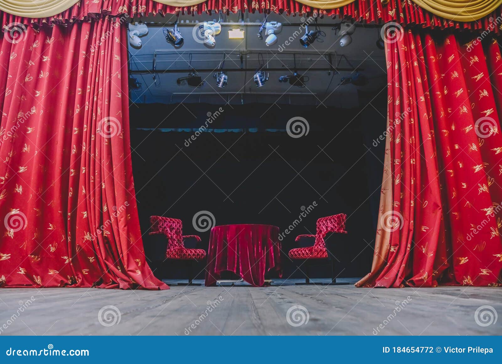 The Backstage of the Theater, with a Table and Chairs in the Center ...