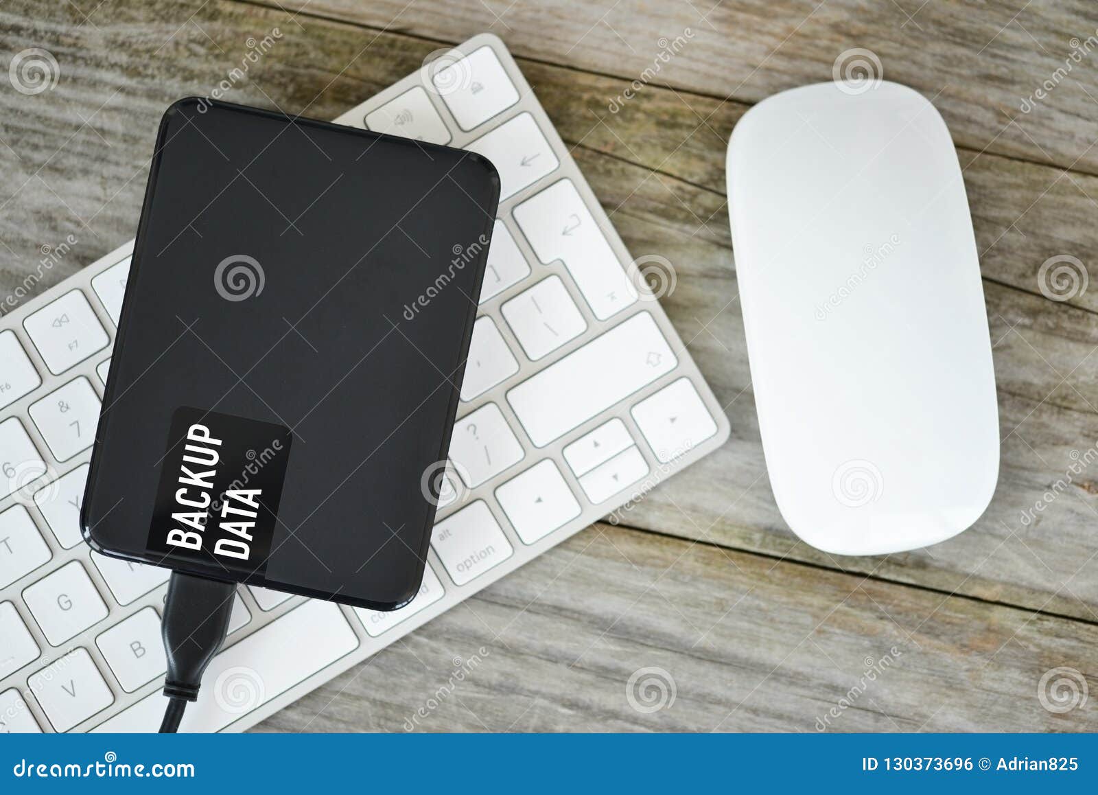 Backup Data with External Hard Disk Drive on White Computer Keyboard ...