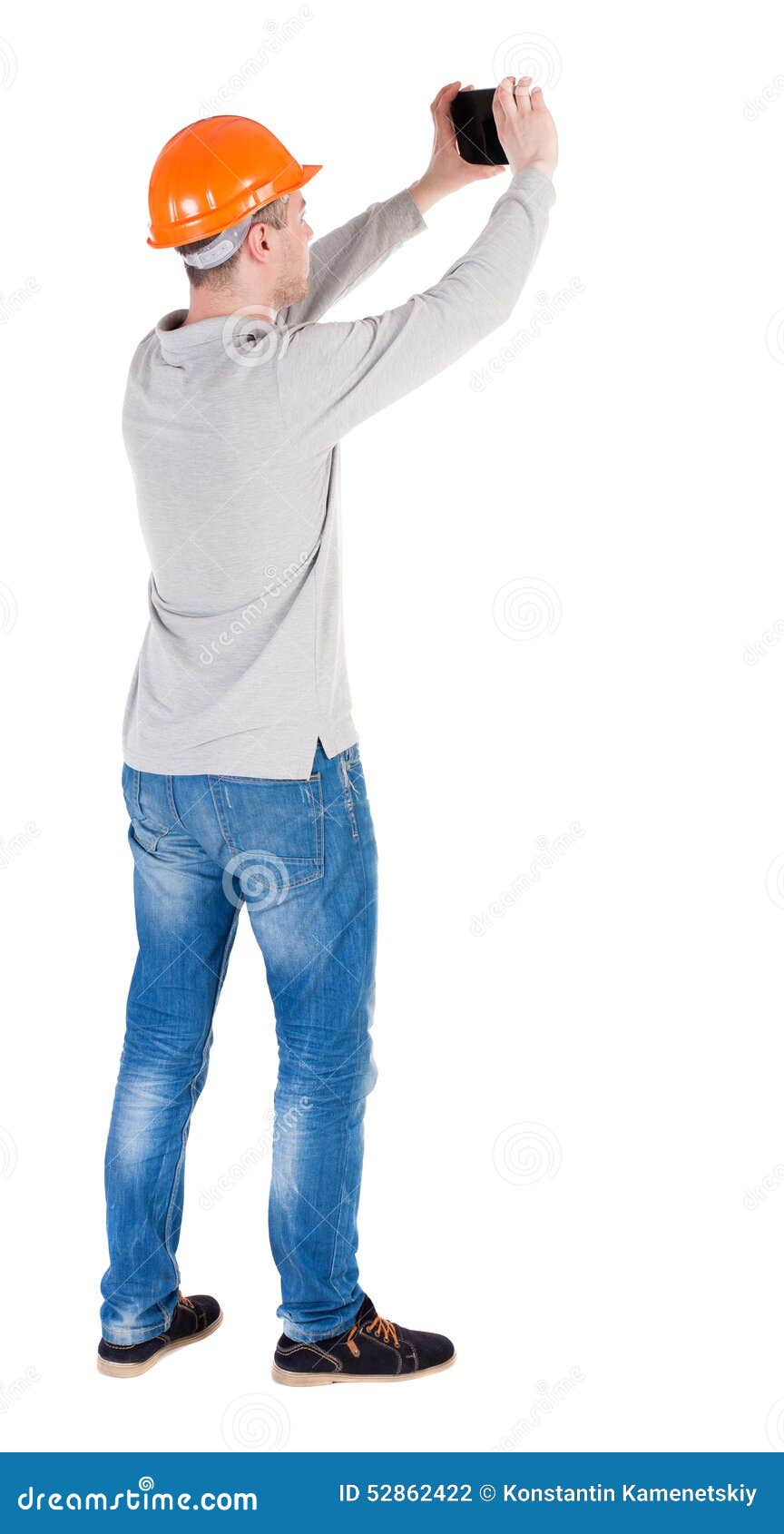 Backview Of An Engineer In Construction Helmet Stands. Royalty-Free ...