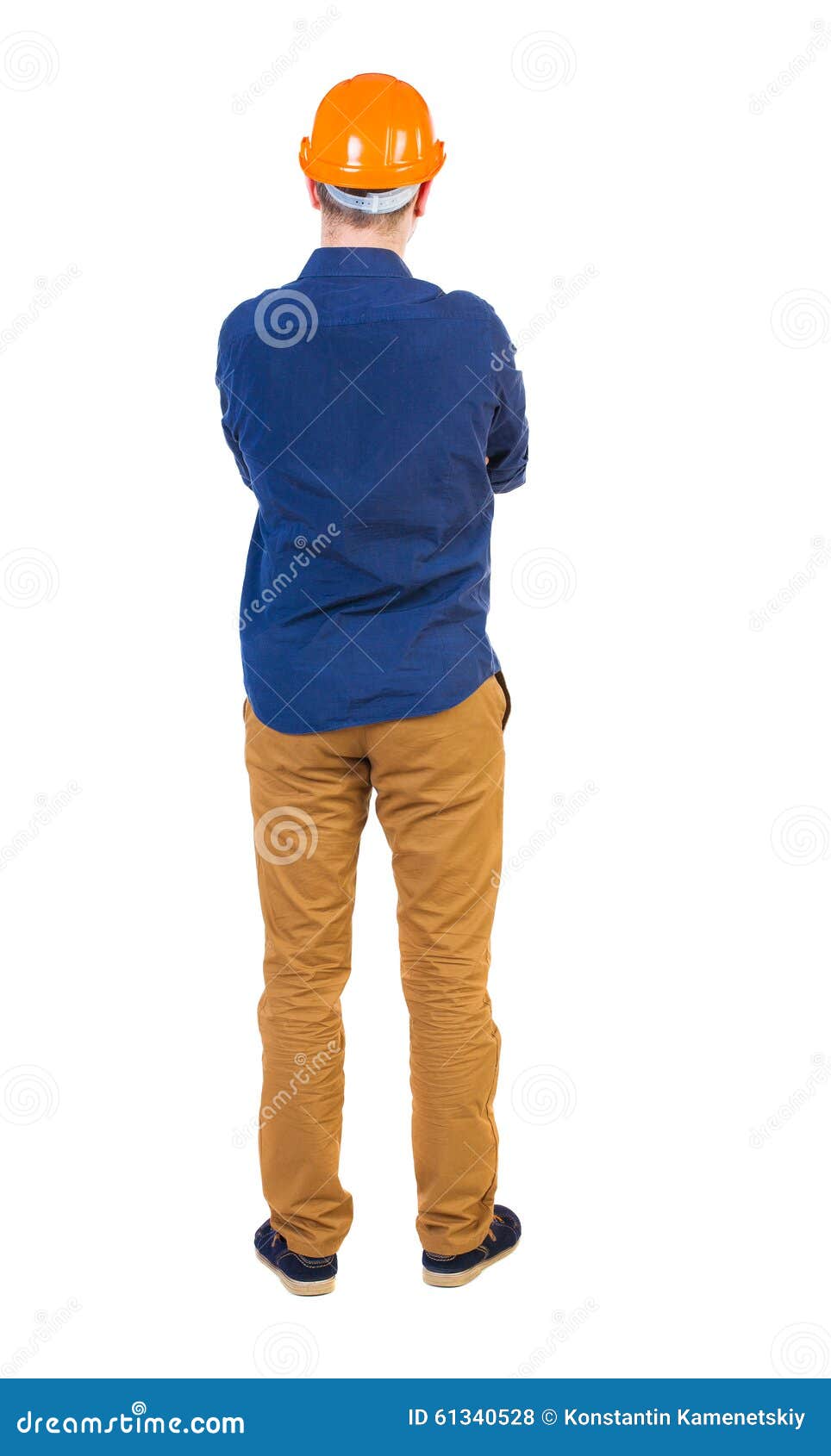 Backview of an Engineer in Construction Helmet Stands. Stock Photo ...