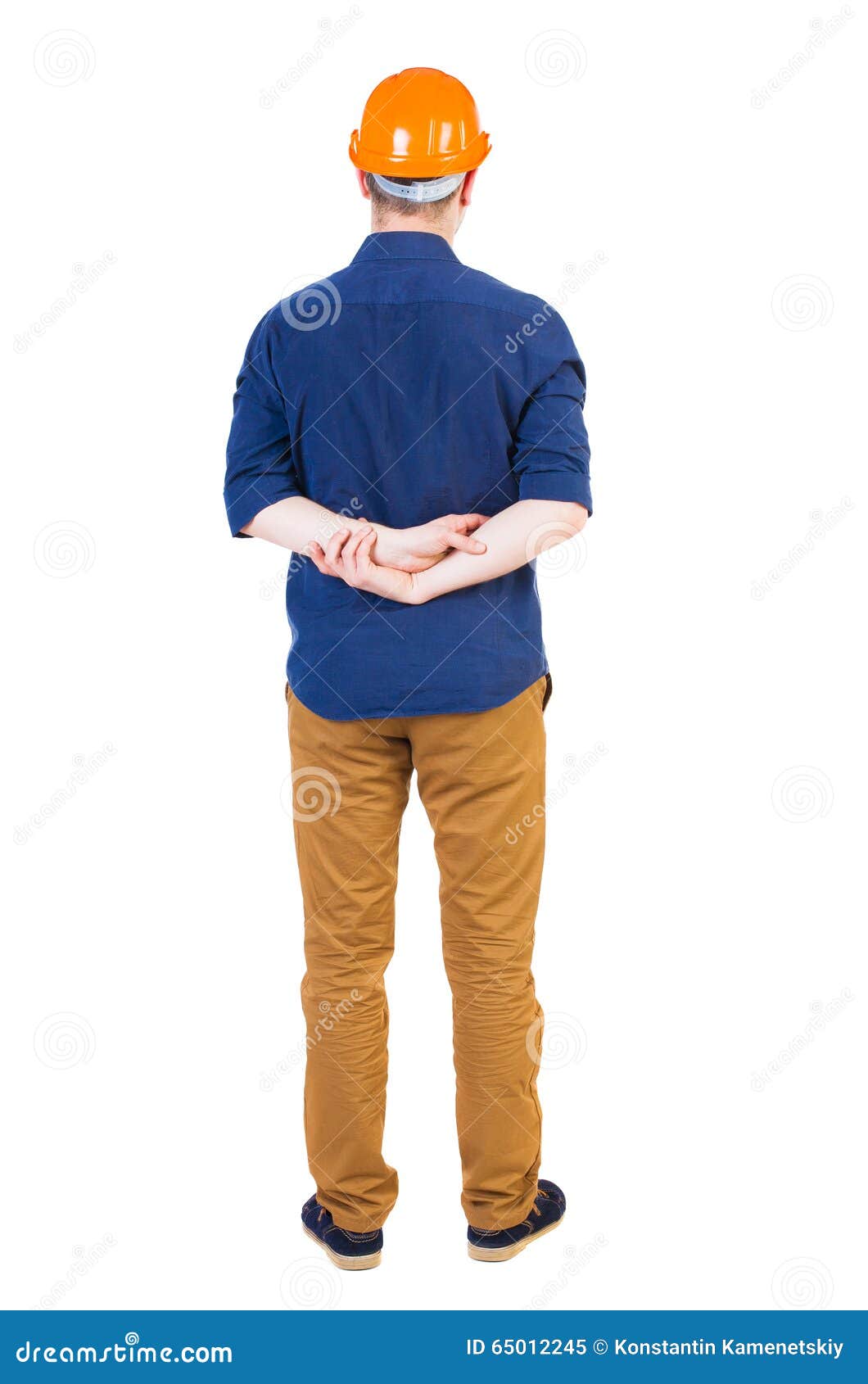 Backview of an Engineer in Construction Helmet Stands. Stock Image ...