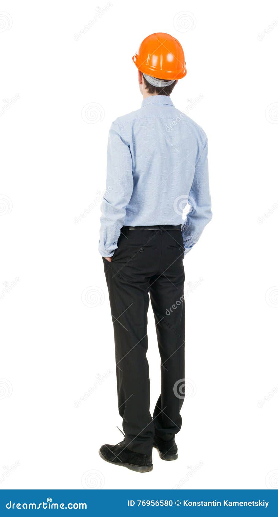 Backview of an Engineer in Construction Helmet Stands. Stock Photo ...