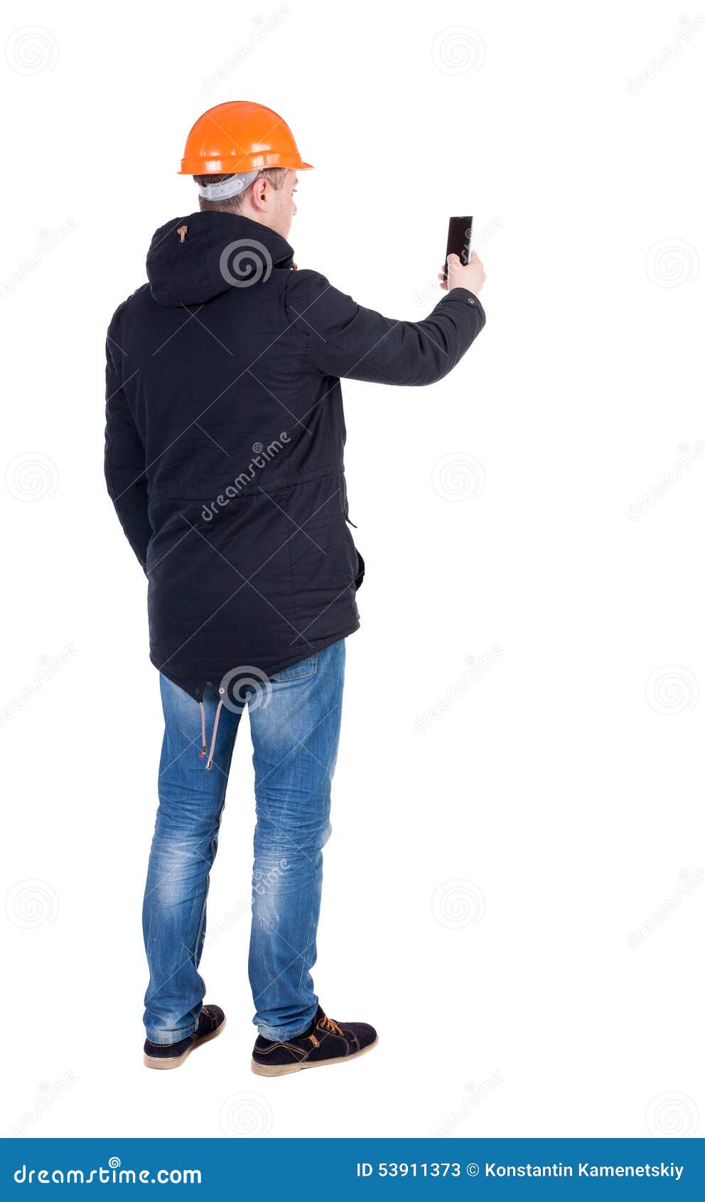 Backview Of An Engineer In Construction Helmet Stands. Royalty-Free ...