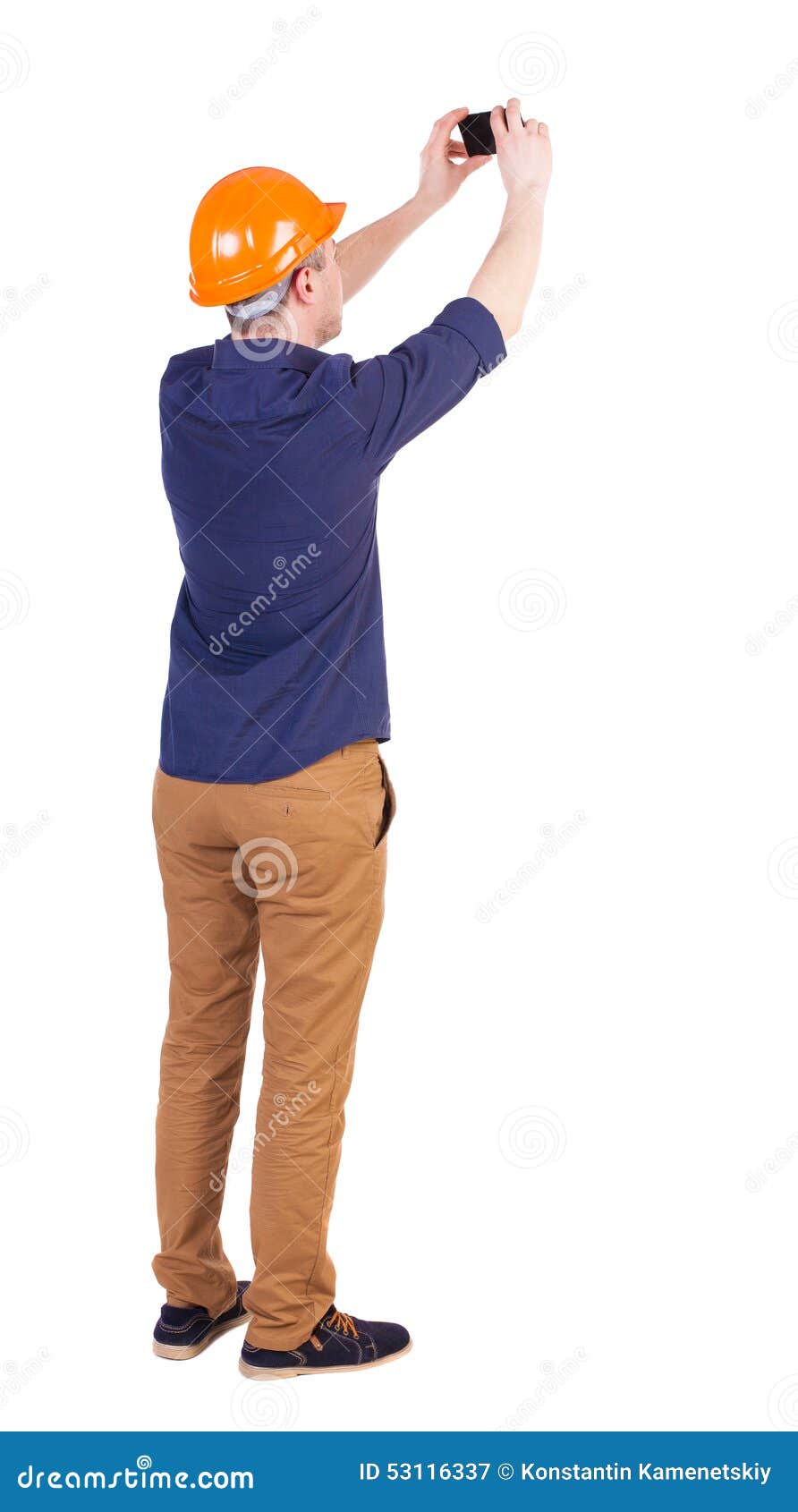 Backview Of An Engineer In Construction Helmet Stands. Royalty-Free ...