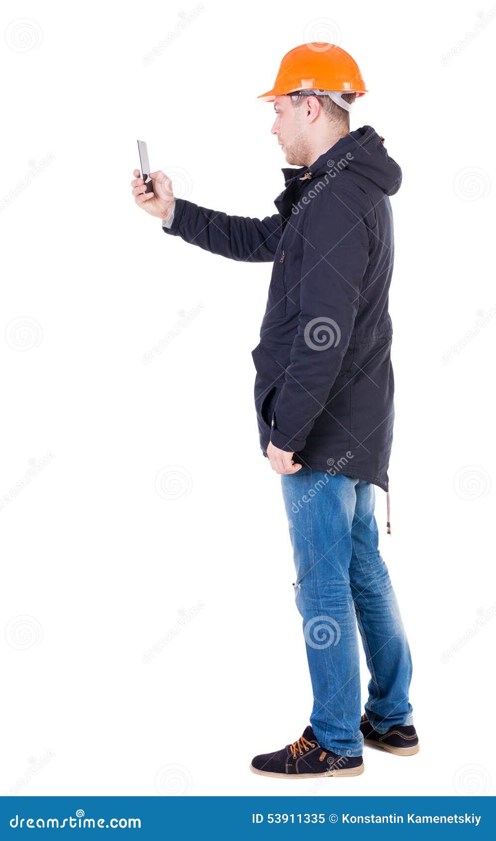 Backview Of An Engineer In Construction Helmet Stands. Royalty-Free ...