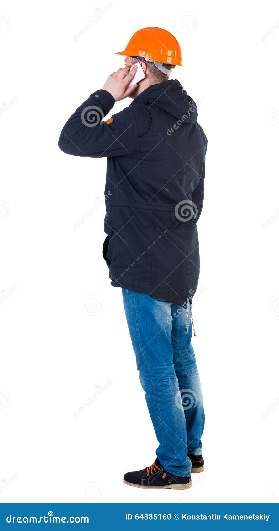 Backview of an Engineer in Construction Helmet Stands and Using Stock ...